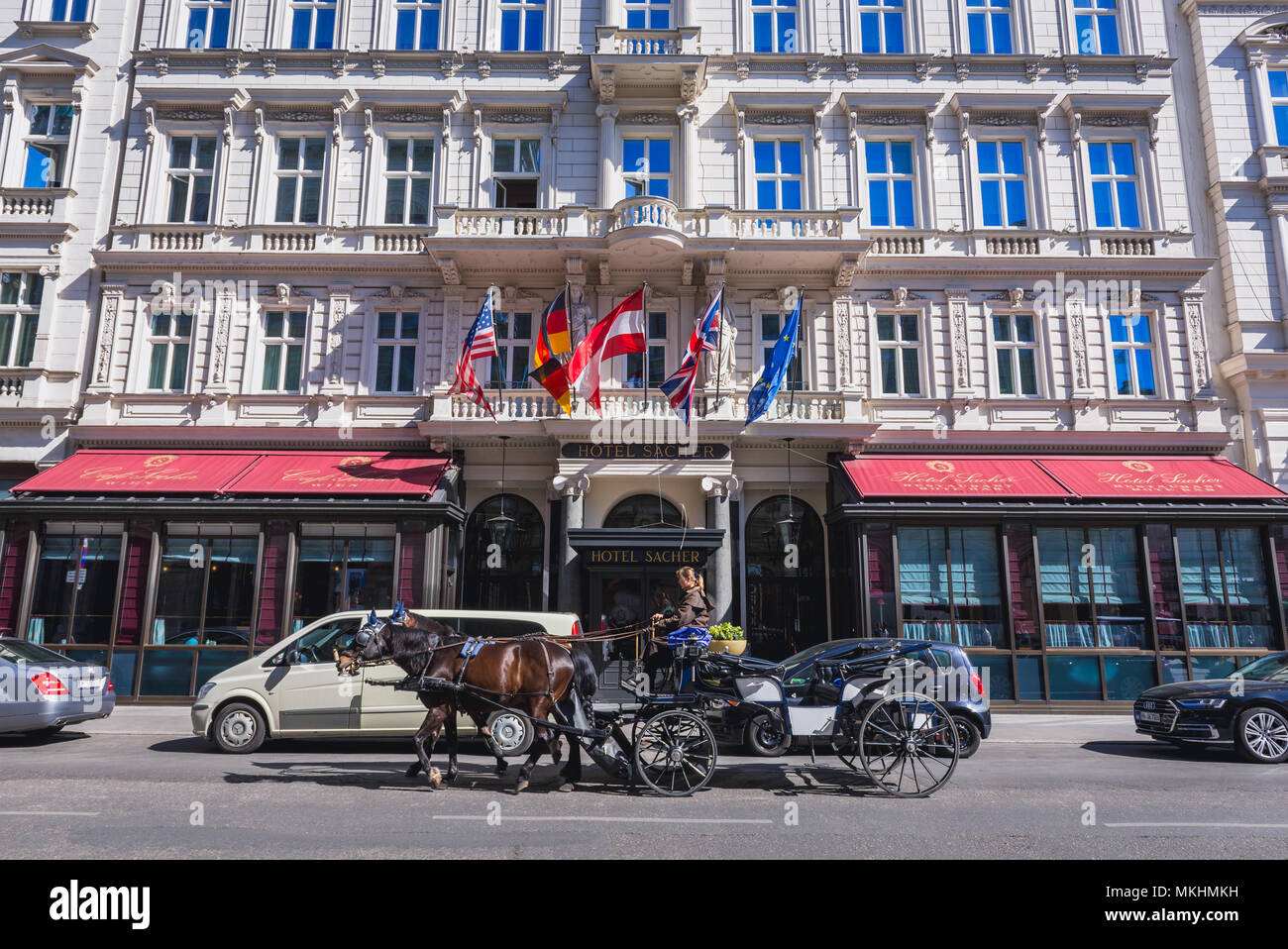 Horse-drawn carriage called Fiaker in front of Hotel Sacher Wien in ...