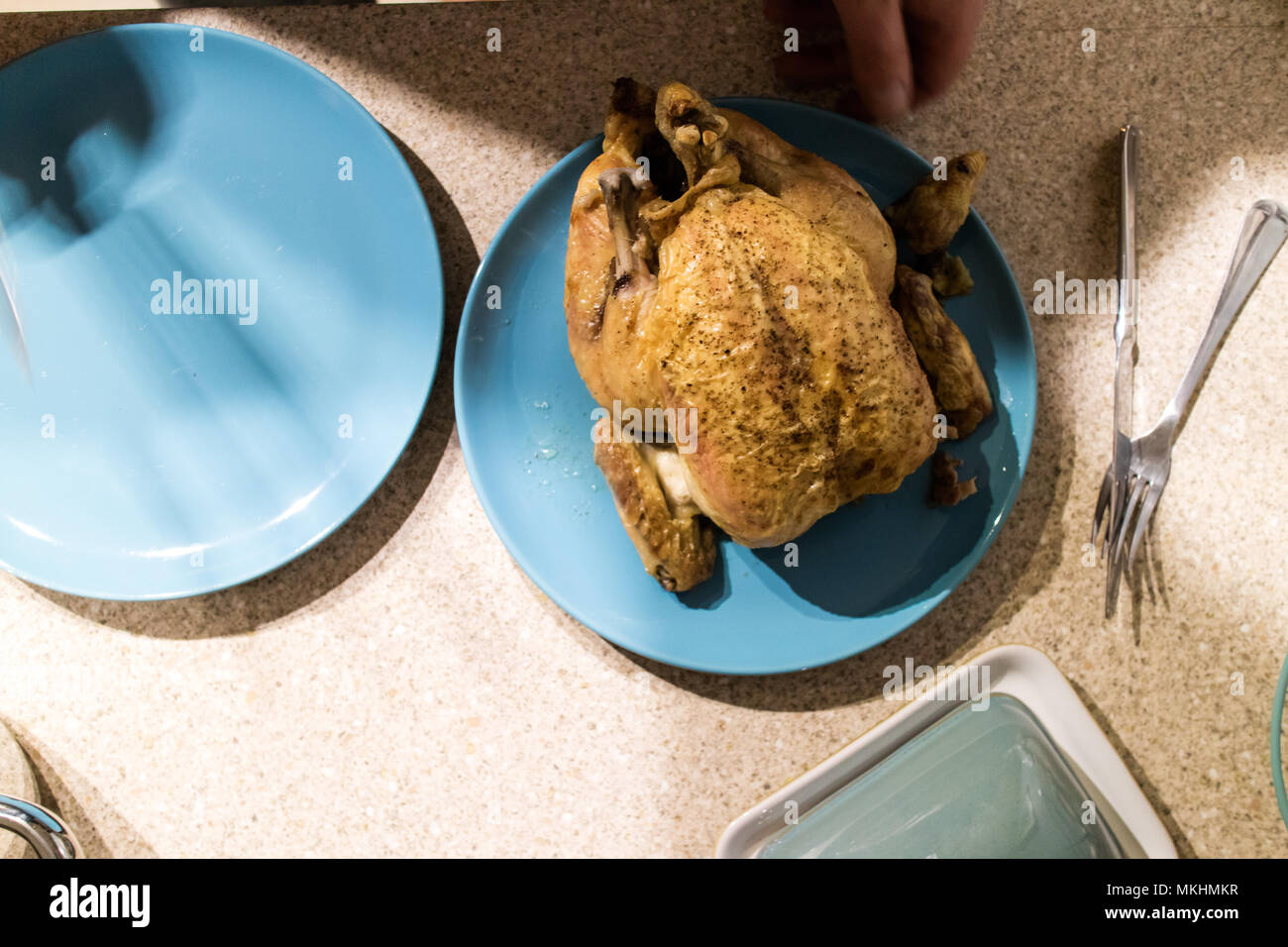Side view of a freshly roasted chicken about to be carved Stock Photo ...