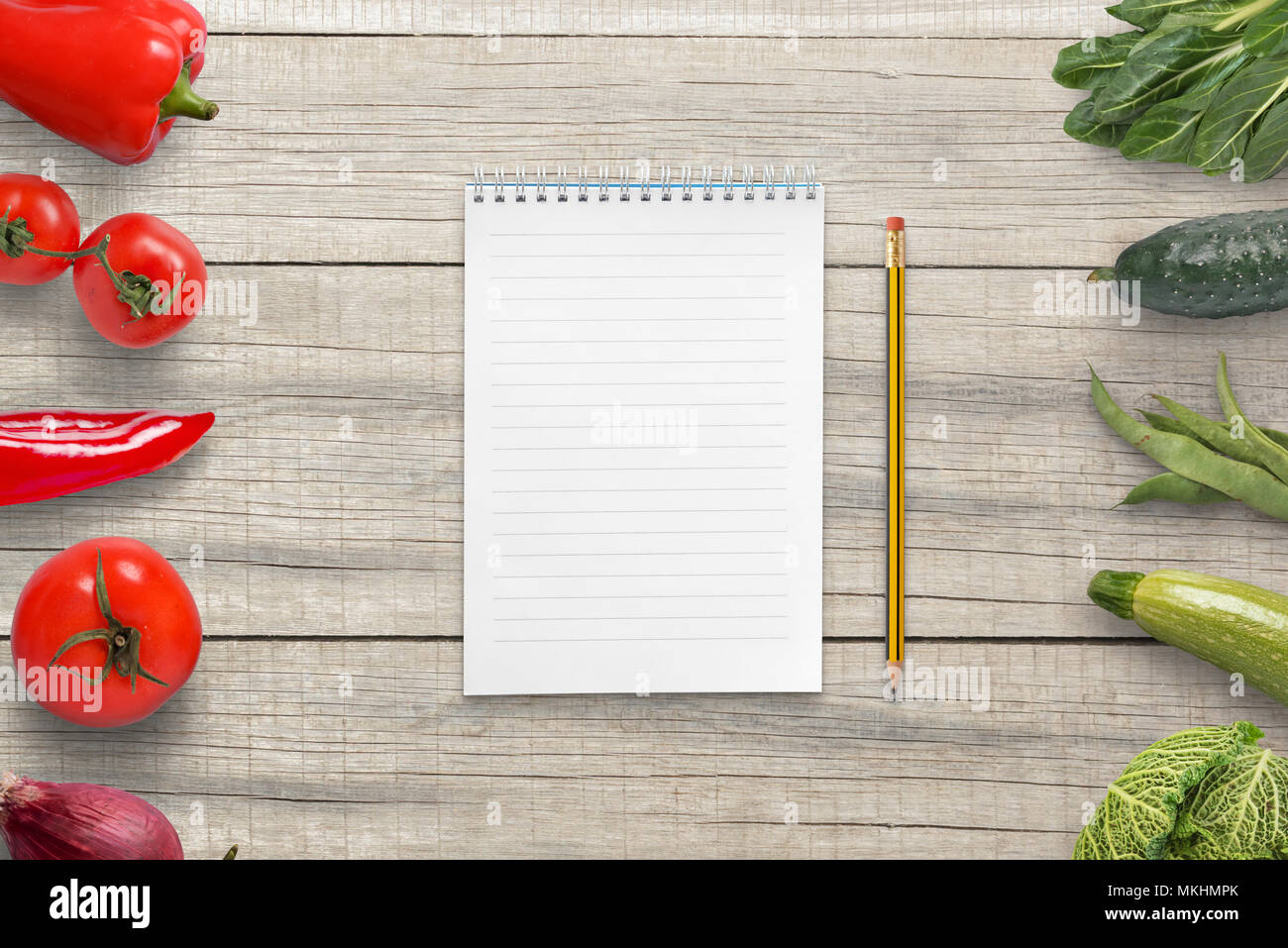 Pad and pencil for writing a vegetarian list of ingredients. Empty ...