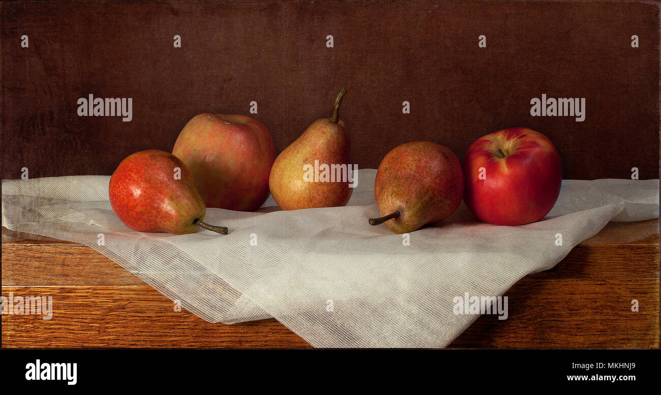 Still life classic with pears and apples on the table with a white ...