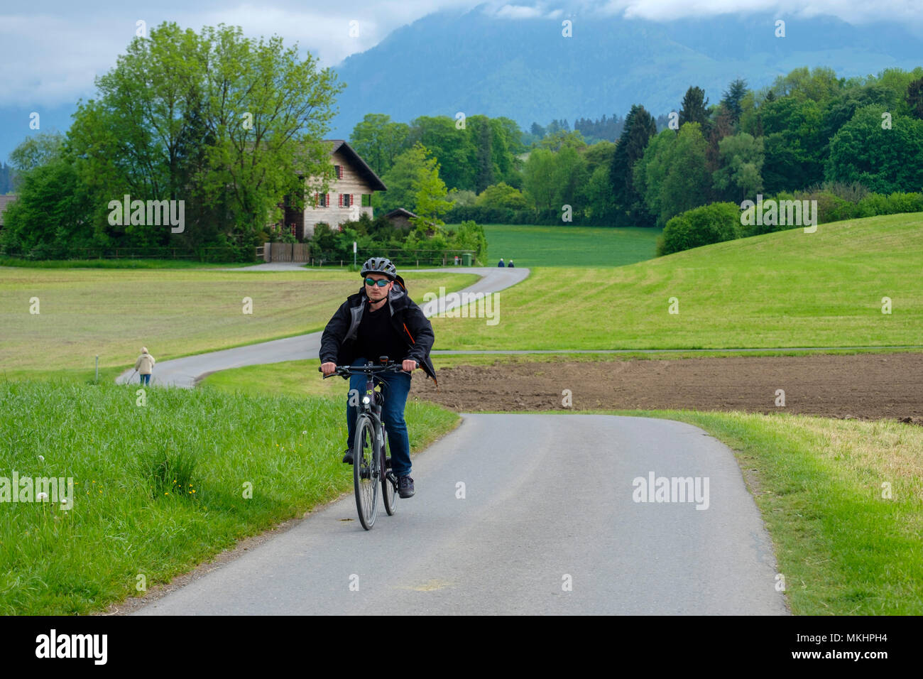 Young man alone riding bicycle hi-res stock photography and images - Alamy