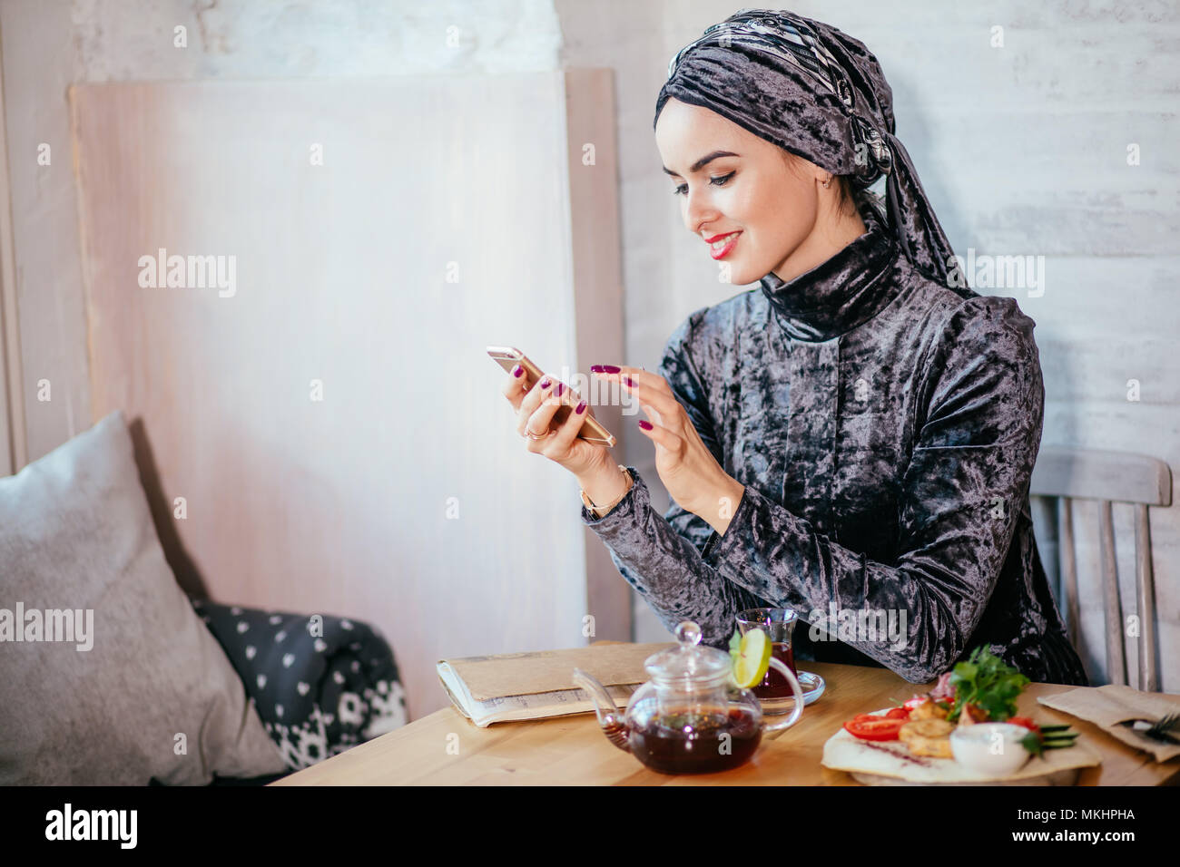 Muslim teen mobile phone hi-res stock photography and images - Alamy