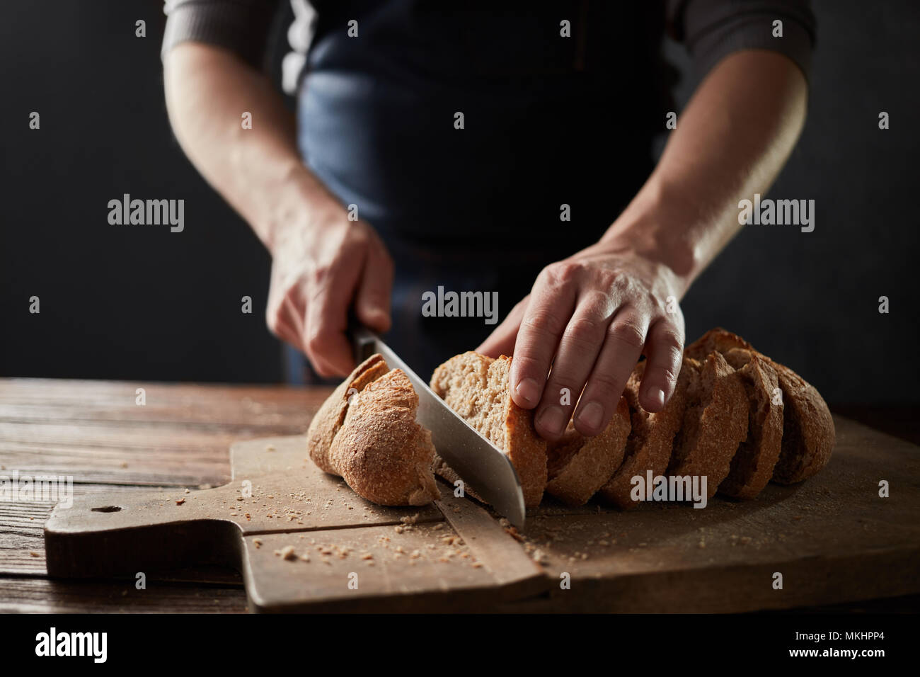 Male hands slicing home made hi-res stock photography and images - Alamy