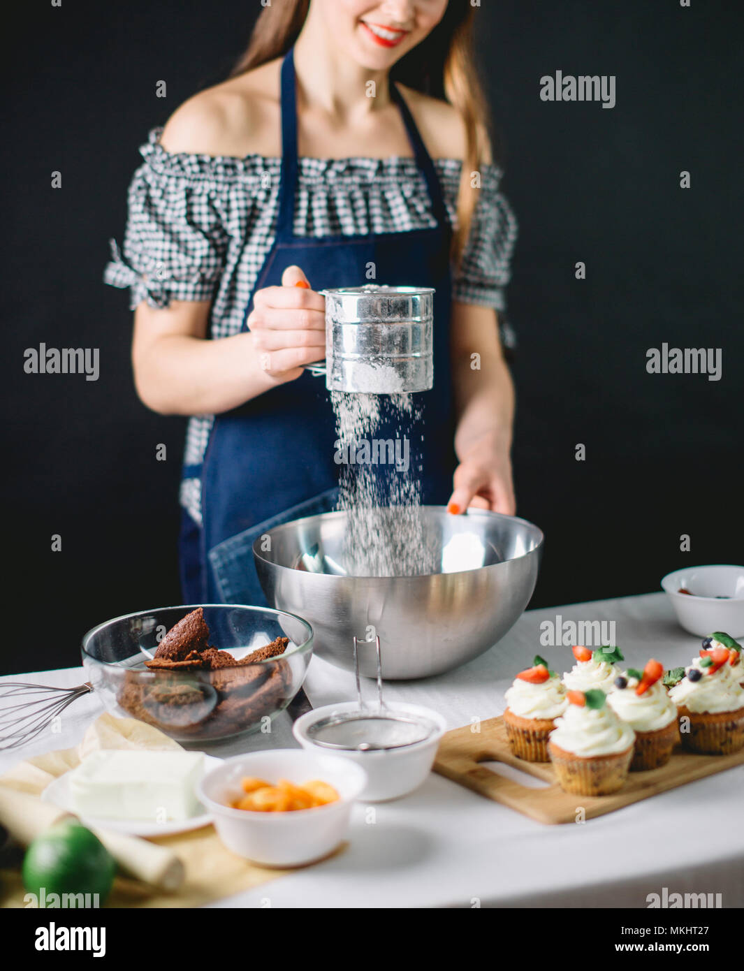 Culinary workshop. Young white woman showing step by step process of ...