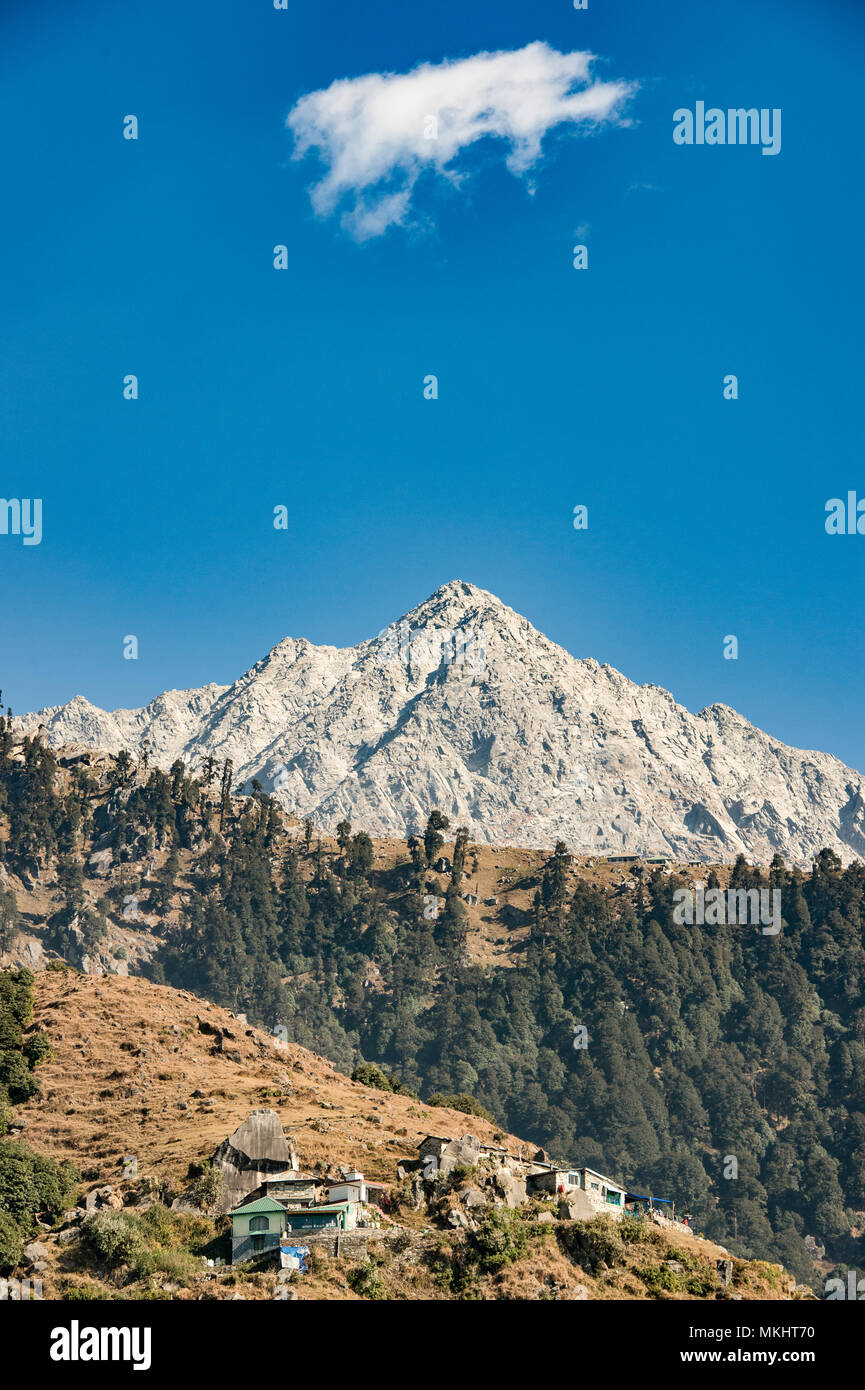A distant view of Dhauladhar Mountain ranges during a sunny day. Triund ...