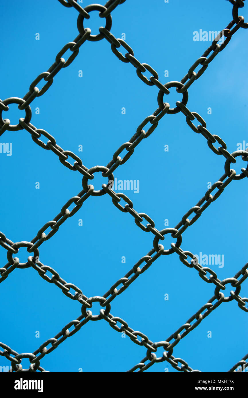Chains of a soccer goal with blue sky Stock Photo - Alamy