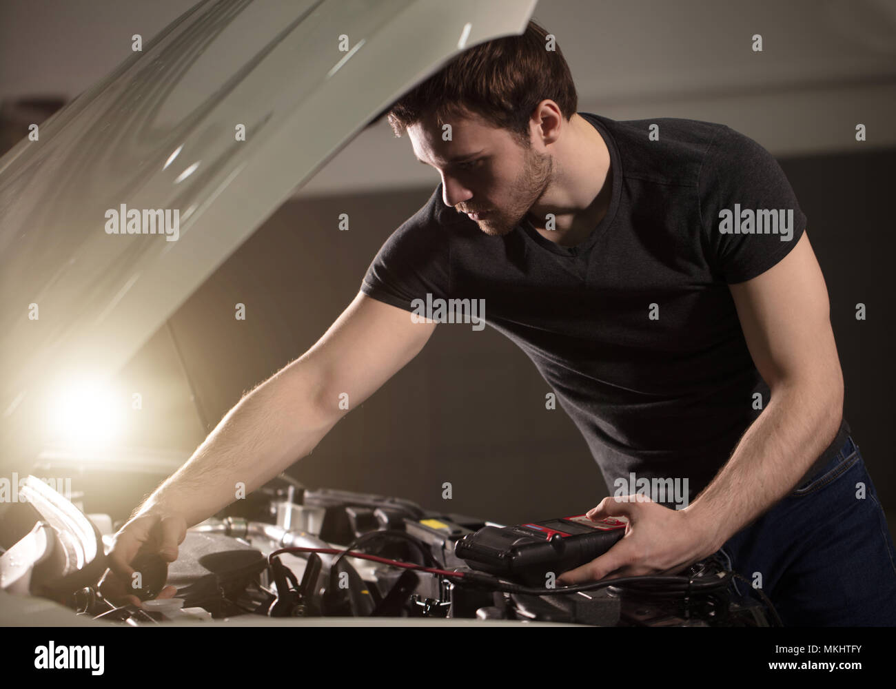 Mechanic Working On Electric Car High Resolution Stock Photography and ...