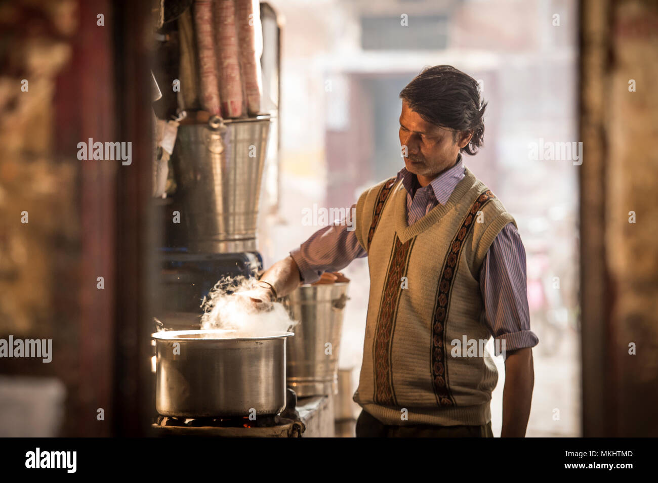 An indian man making chai hi-res stock photography and images - Alamy