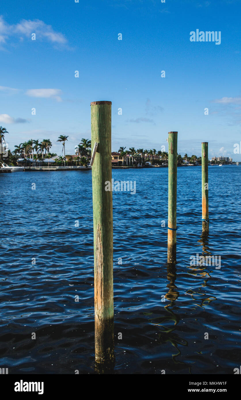 Old Wood Mooring Posts in the Intracoastal Waterway Stock Photo - Alamy