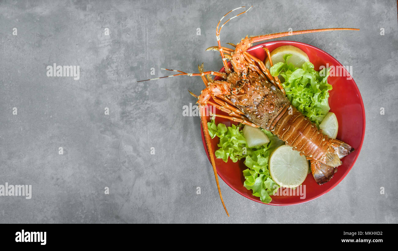 Top view of steamed lobster with fresh vegetable on plate Stock Photo ...