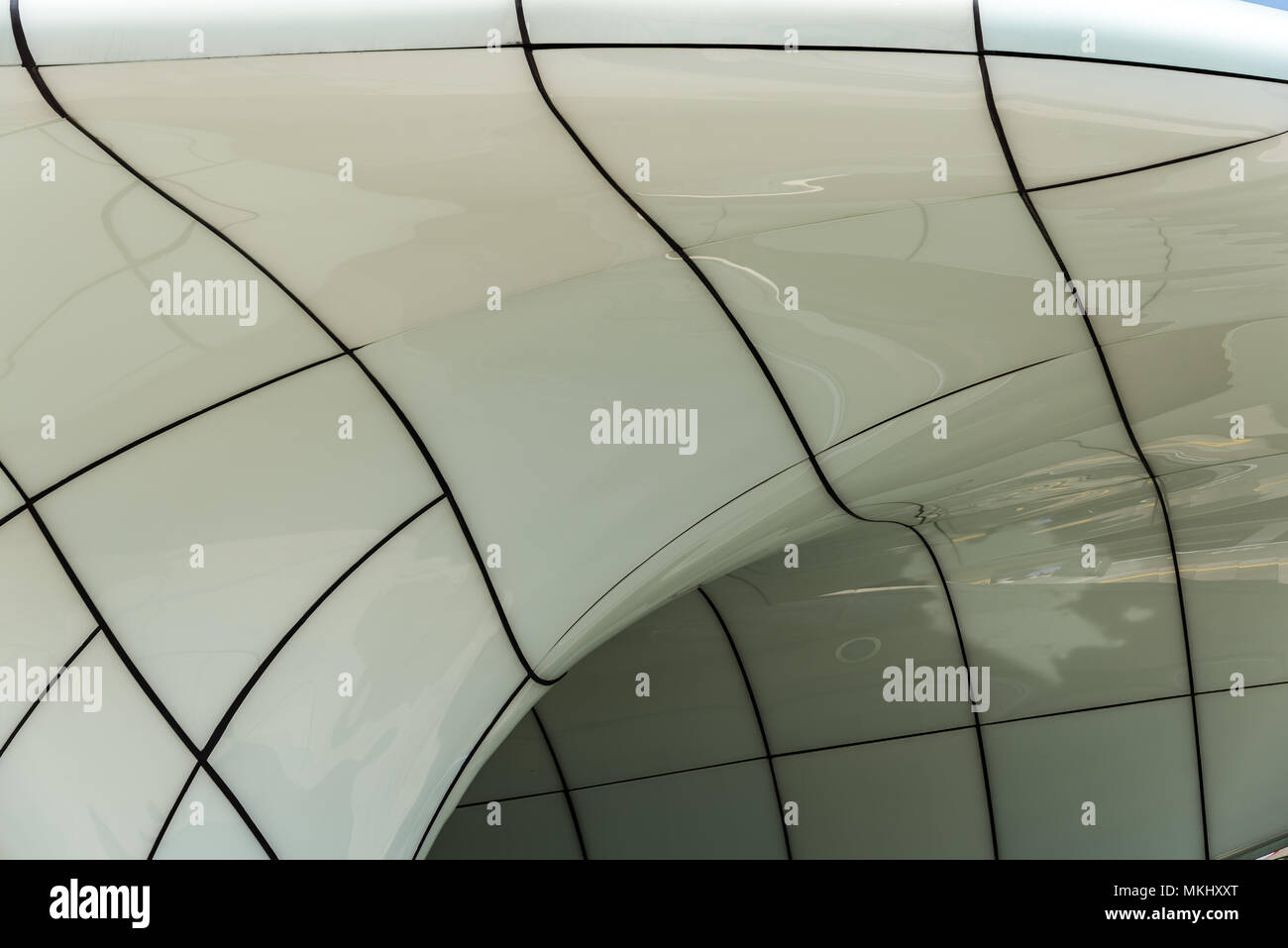 Background of bright warped surface in modern architecture building ...