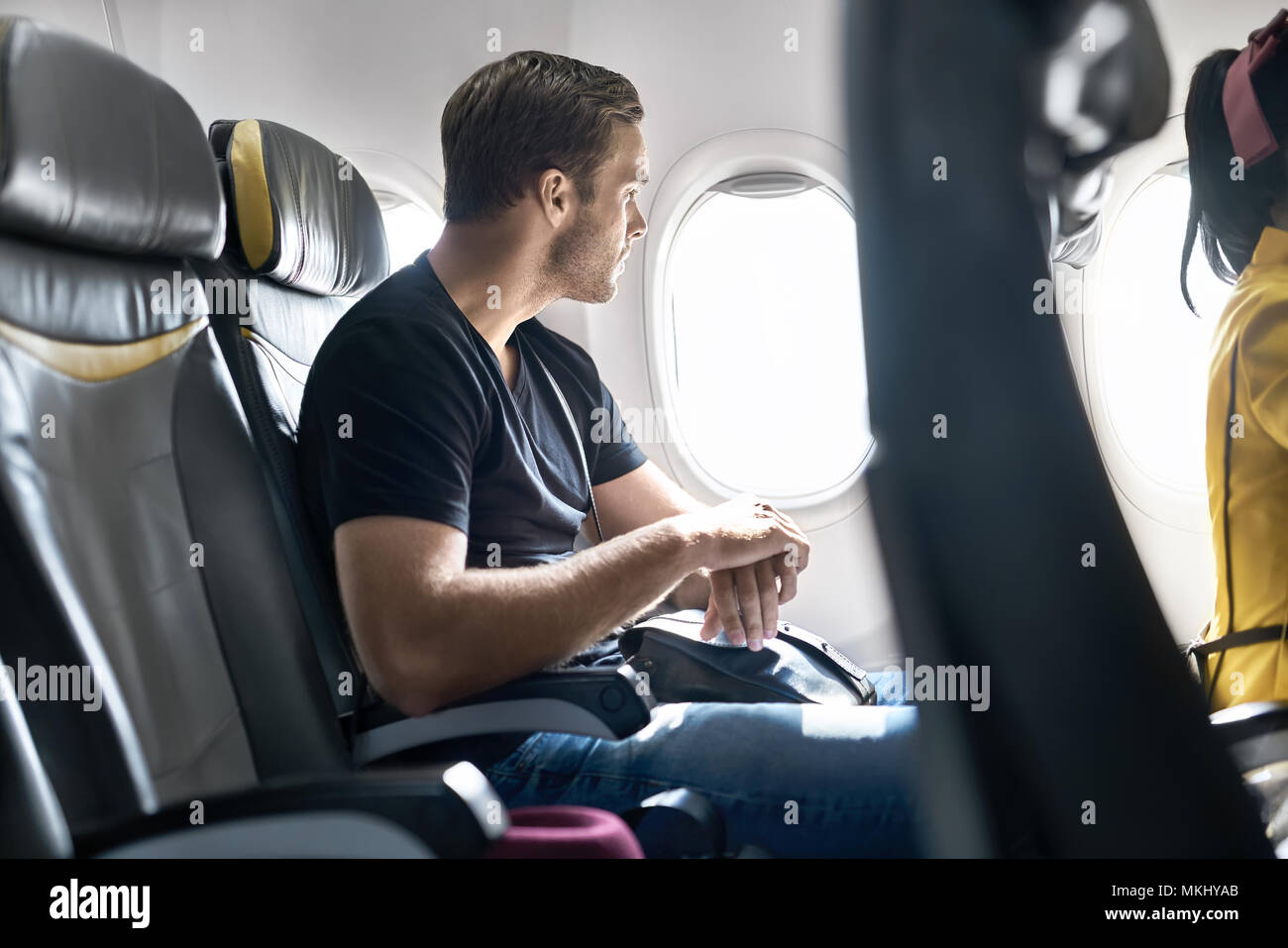 Male tourist sitting in airplane hi-res stock photography and images ...