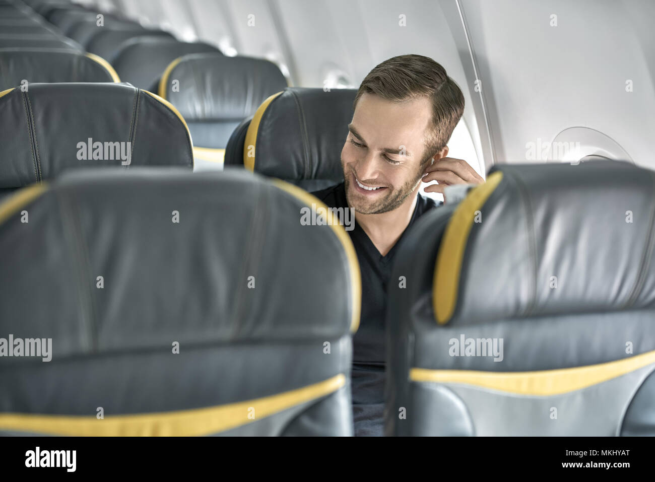 Handsome guy in airplane Stock Photo - Alamy