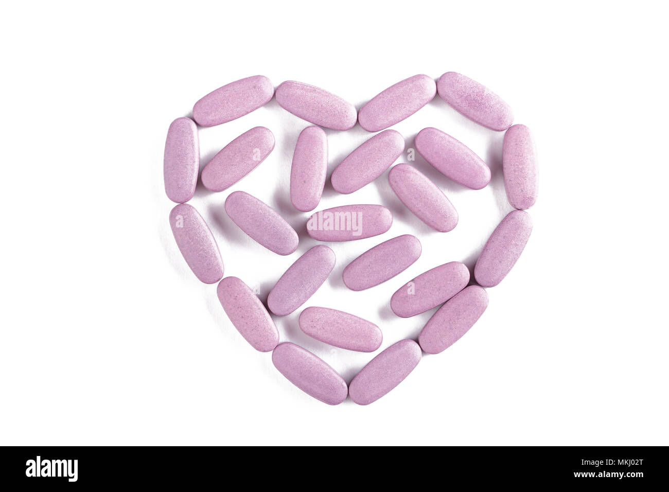 tablets are scattered in the form of heart, the concept of treatment of ...