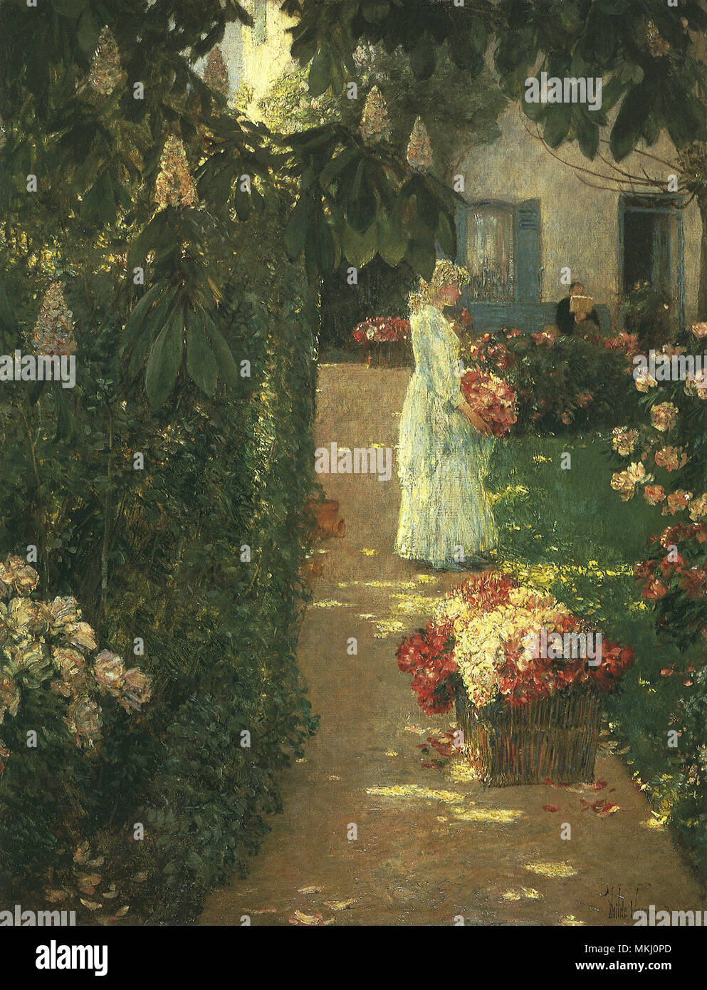 Gathering Flowers in a French Garden Stock Photo - Alamy