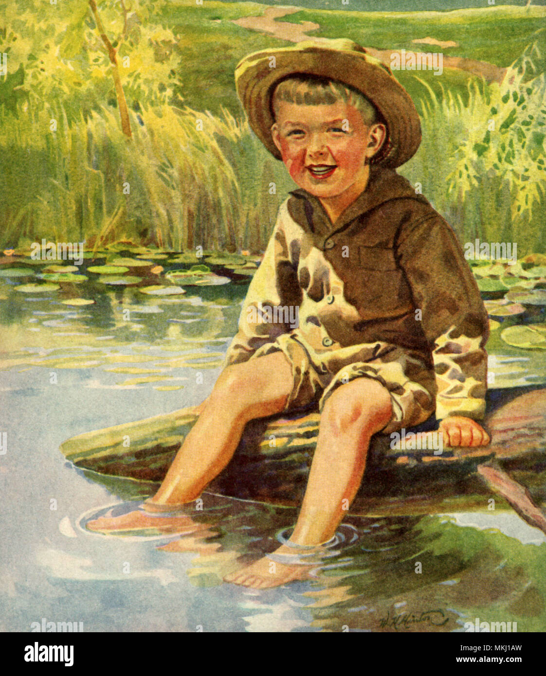 Boy Sitting on Log Stock Photo - Alamy