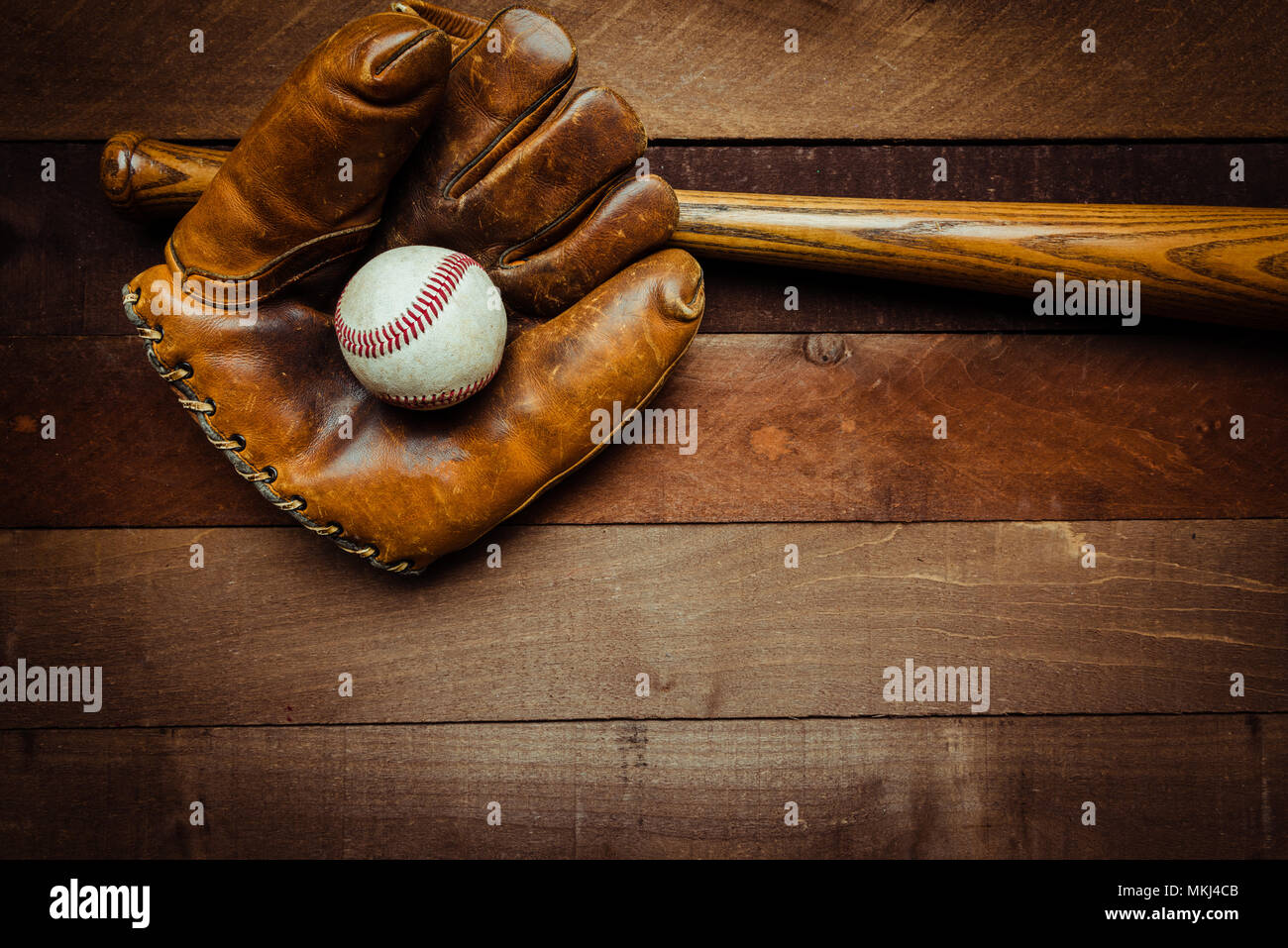 Vintage baseball gear on a wooden background Stock Photo - Alamy