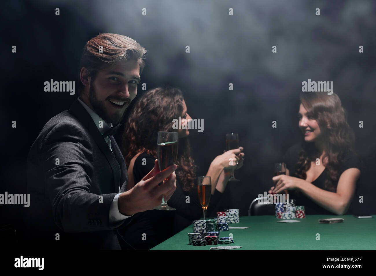Happy and rich people celebrating their win after successful game Stock ...