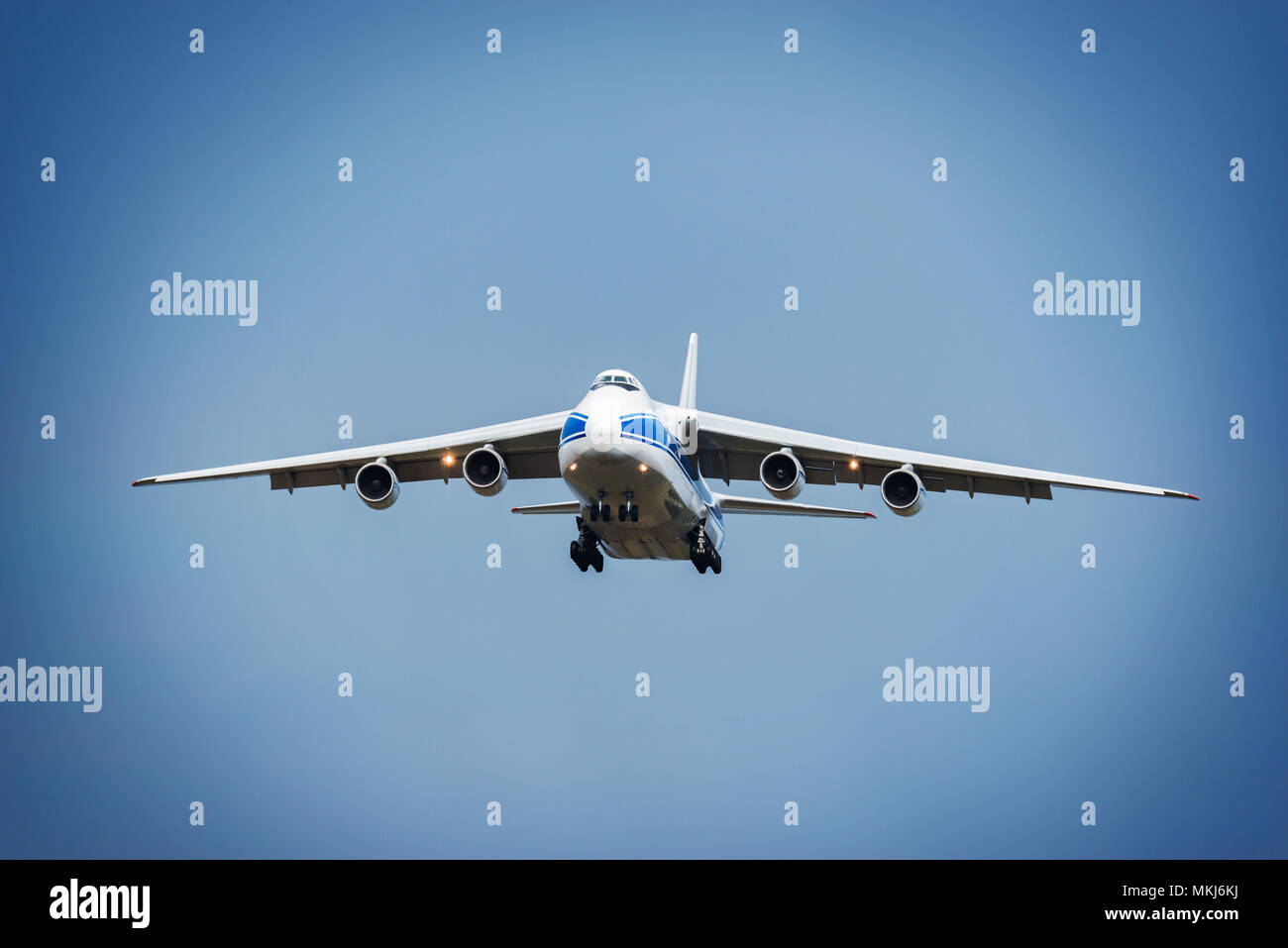 Flight of the big cargo airliner at day time Stock Photo - Alamy