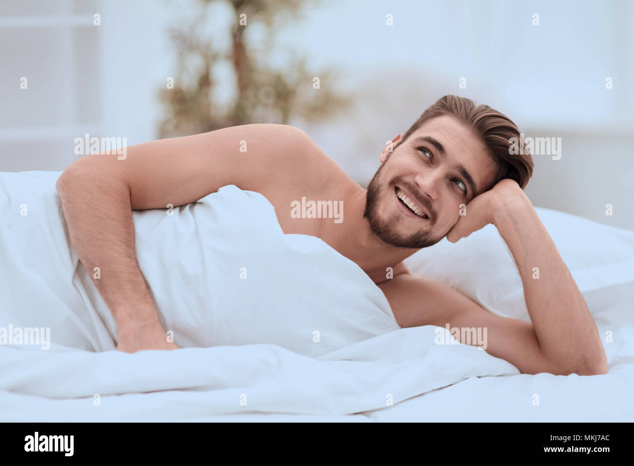 Young man dreams on bed hi-res stock photography and images - Alamy