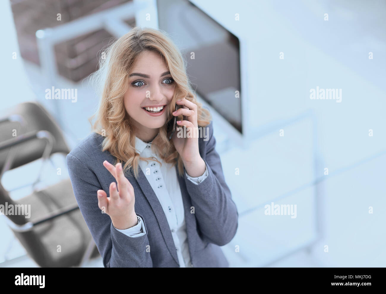 happy employee is talking on the smartphone Stock Photo - Alamy