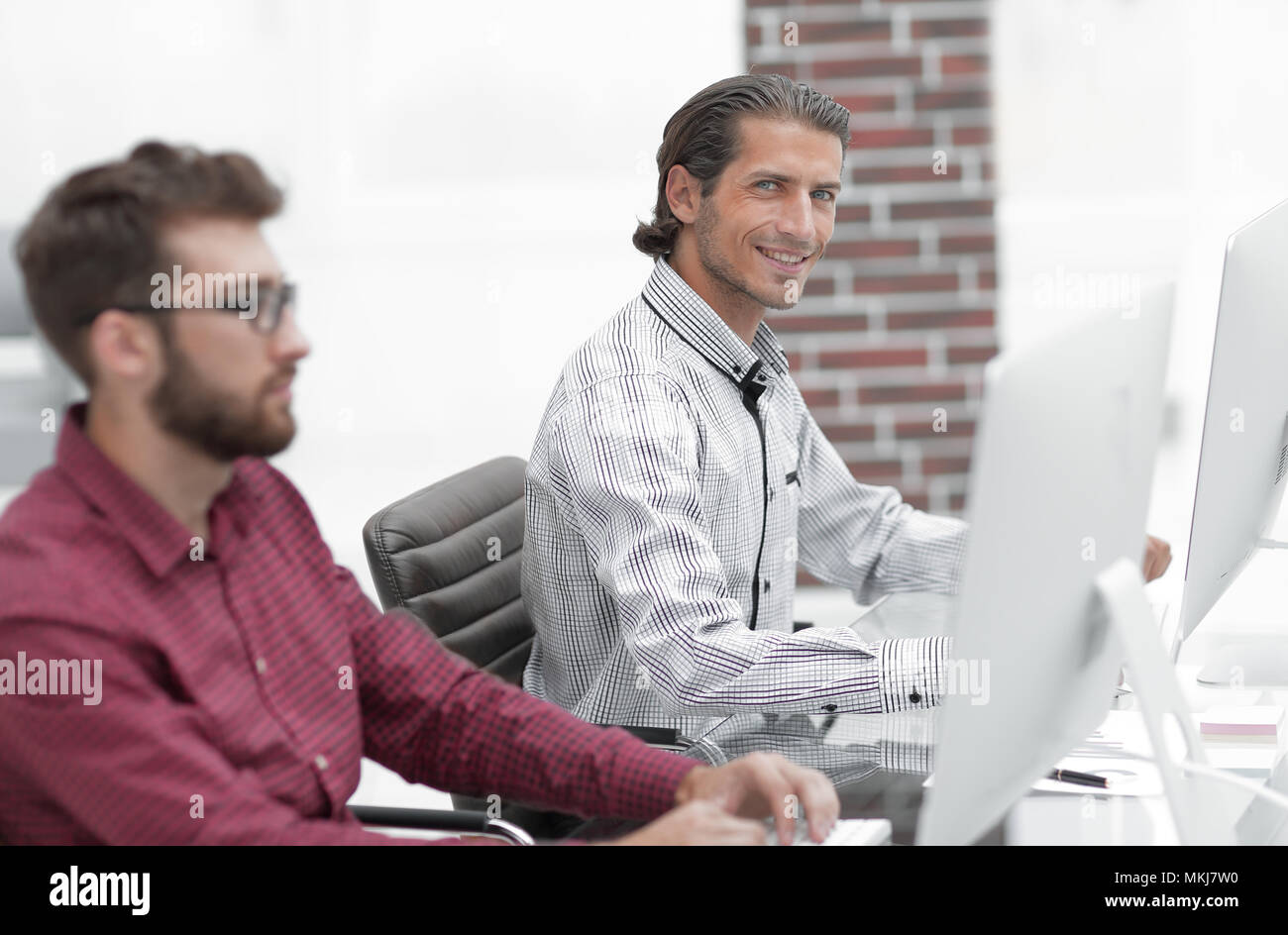 two employees work in the office Stock Photo - Alamy