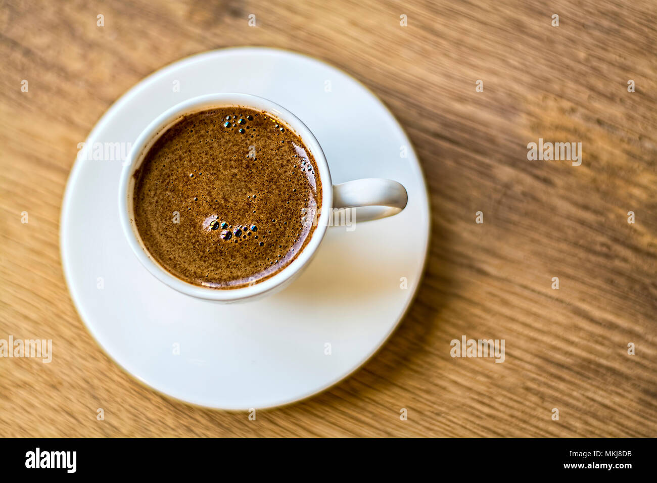 Turkish Coffee in White Porcelain Cup Top View Stock Photo - Alamy
