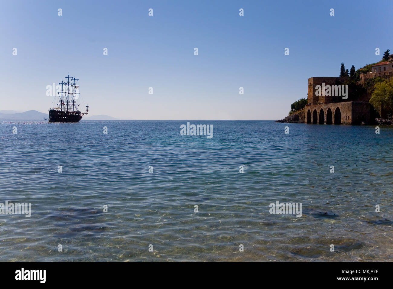The medieval ship dropped anchor near the ancient fortress. Turkey ...