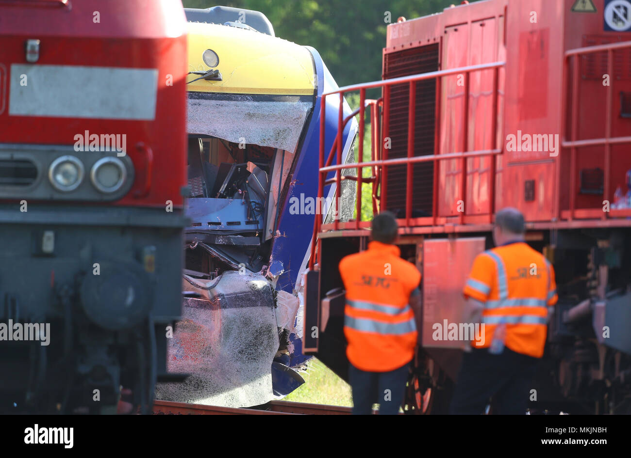 08 May 2018, Germany, Aichach: Railway workers separating a passenger ...