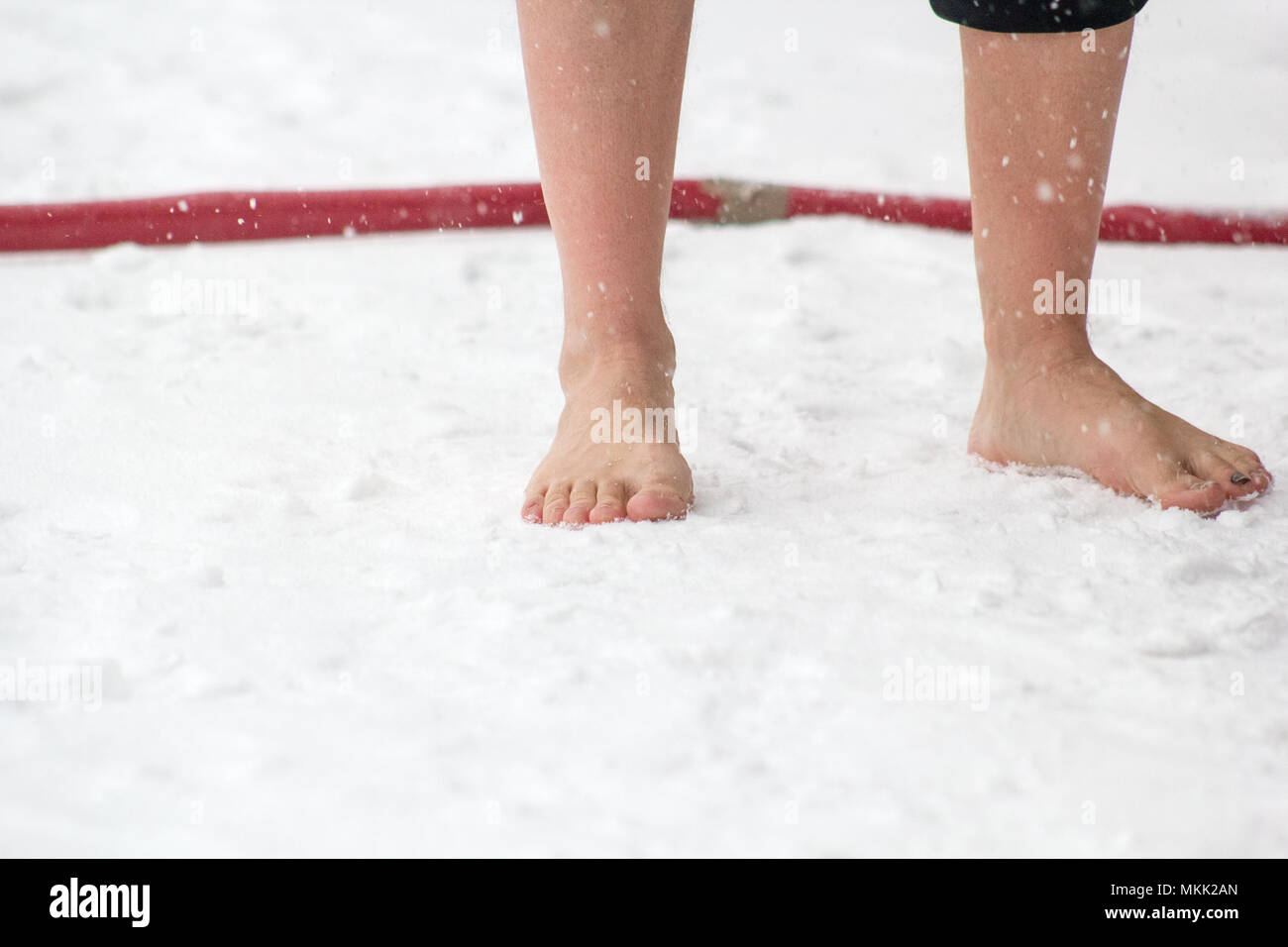 Barefoot in the snow hi-res stock photography and images - Alamy