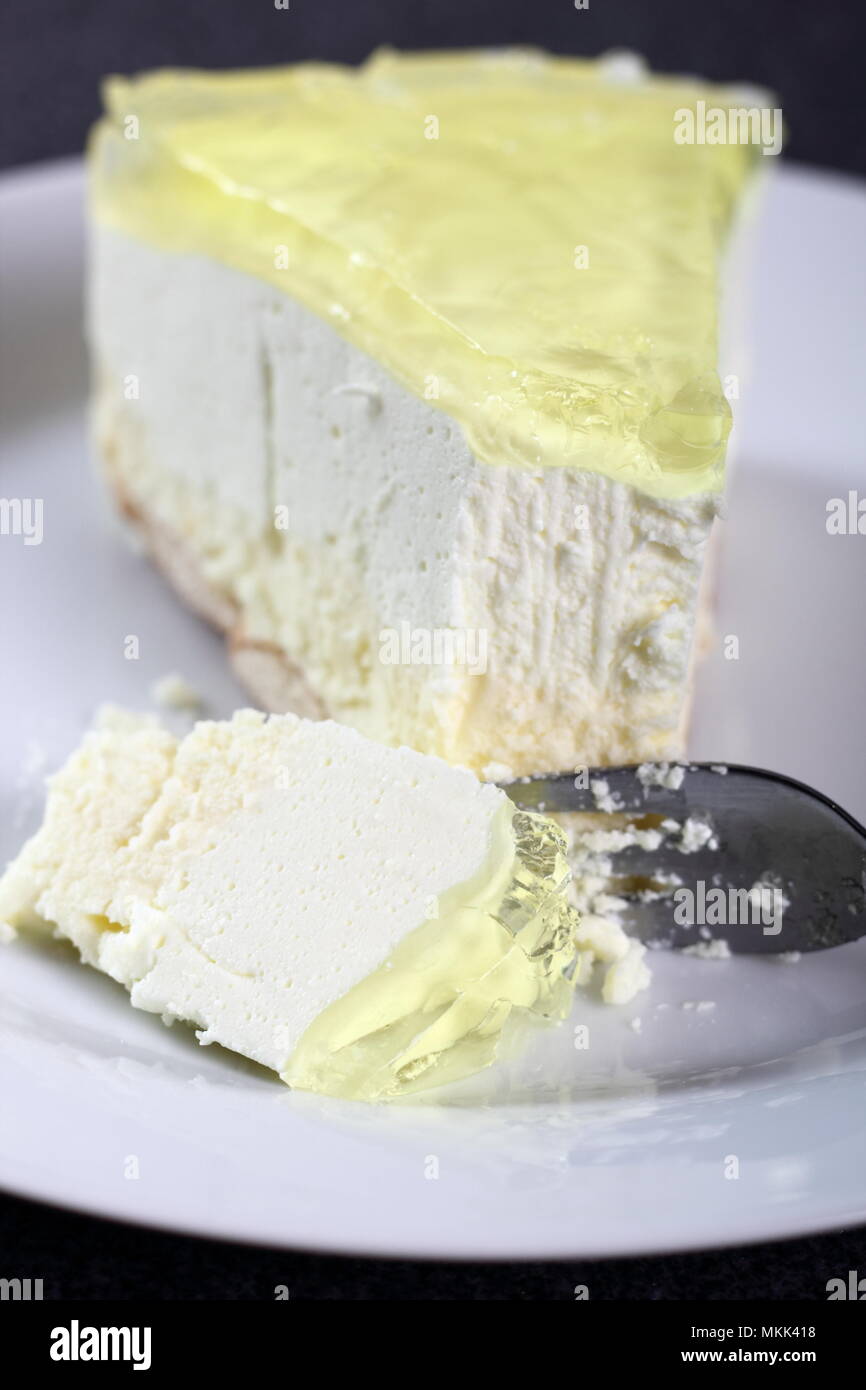Cheesecake with lemon jelly topping Stock Photo - Alamy