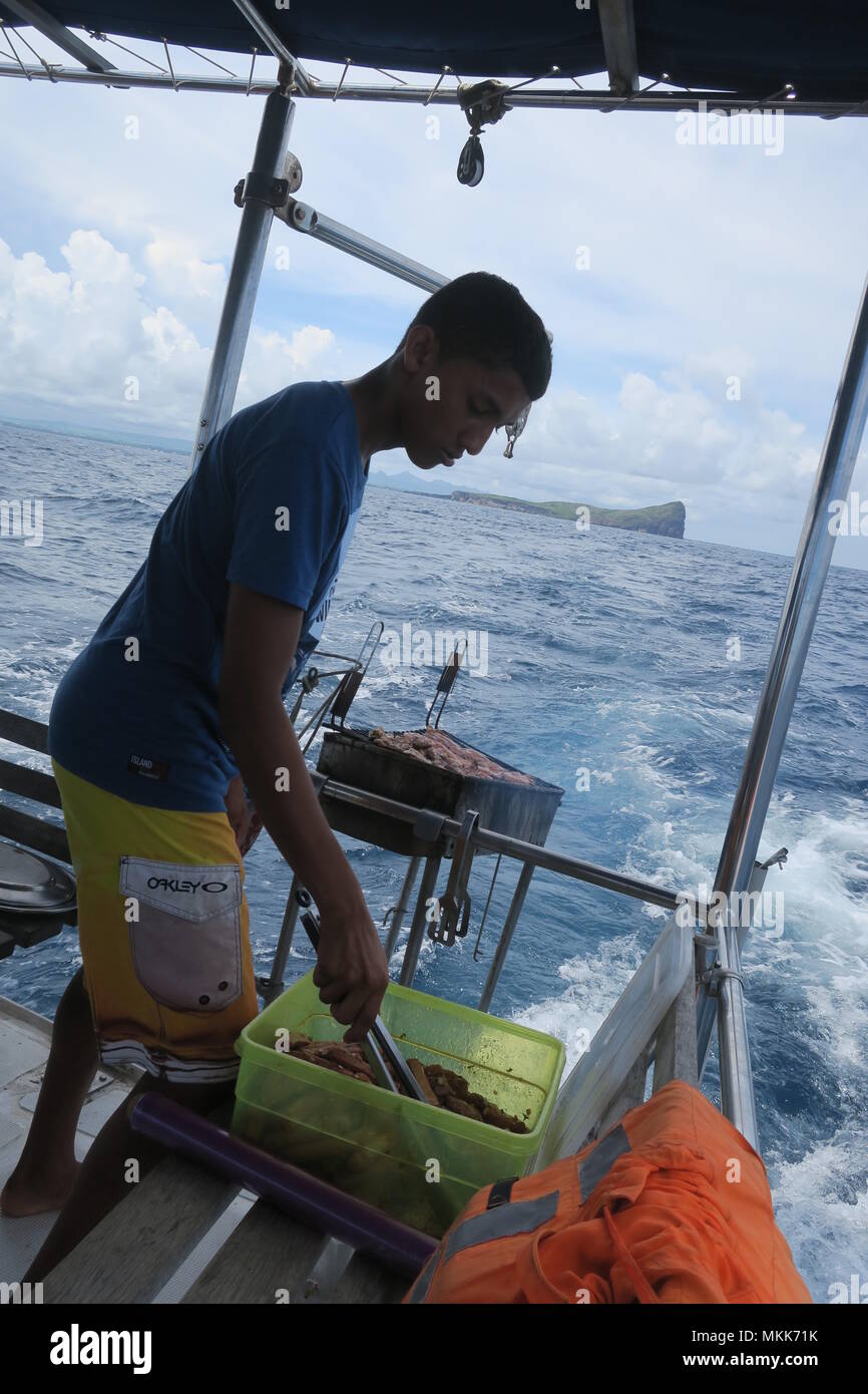 Ship's cook is making meal for tourist in a ship while sailing to an ...