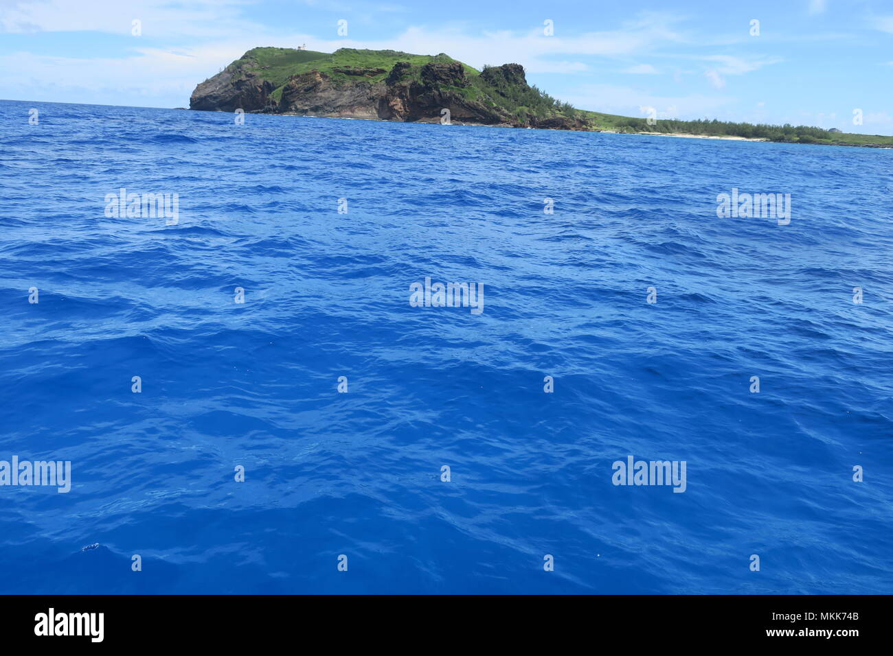 Mighty rock in Indian ocean near Mauritius island Stock Photo - Alamy