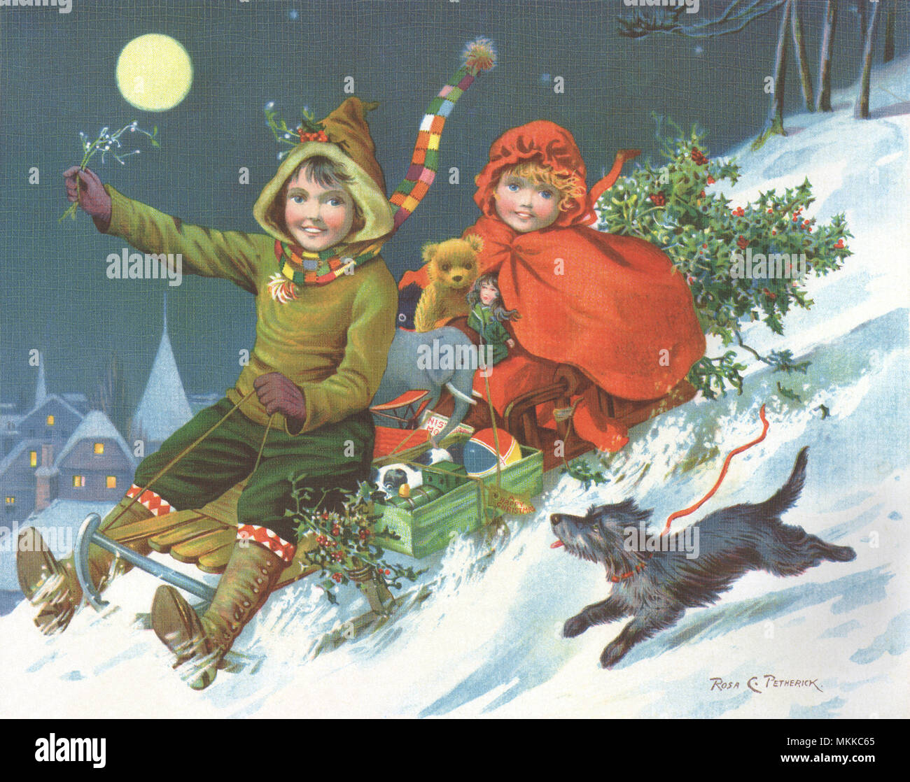 Kids on Sled at Night Stock Photo - Alamy