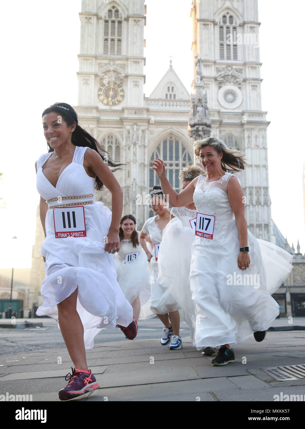 EDITORIAL USE ONLY Brides and grooms-to-be in full wedding attire ...