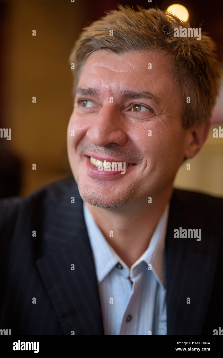 Happy man relaxing in cafe hi-res stock photography and images - Alamy