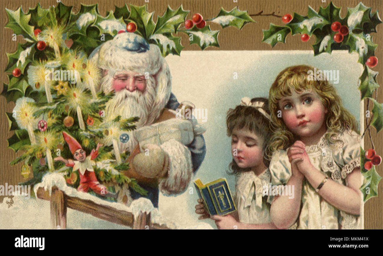Santa and Praying Girls Stock Photo - Alamy