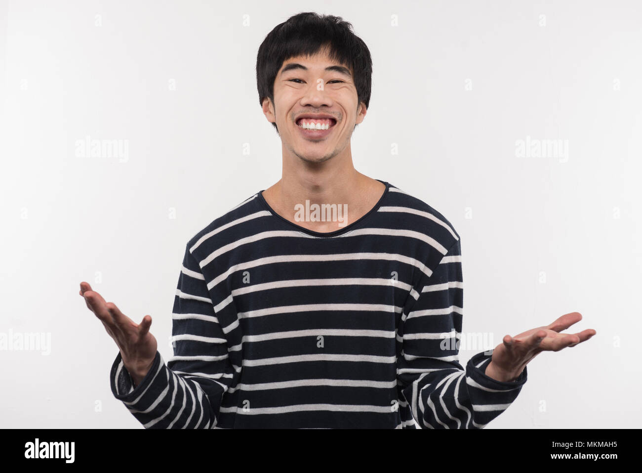 Joyful Asian man expressing his emotions Stock Photo - Alamy