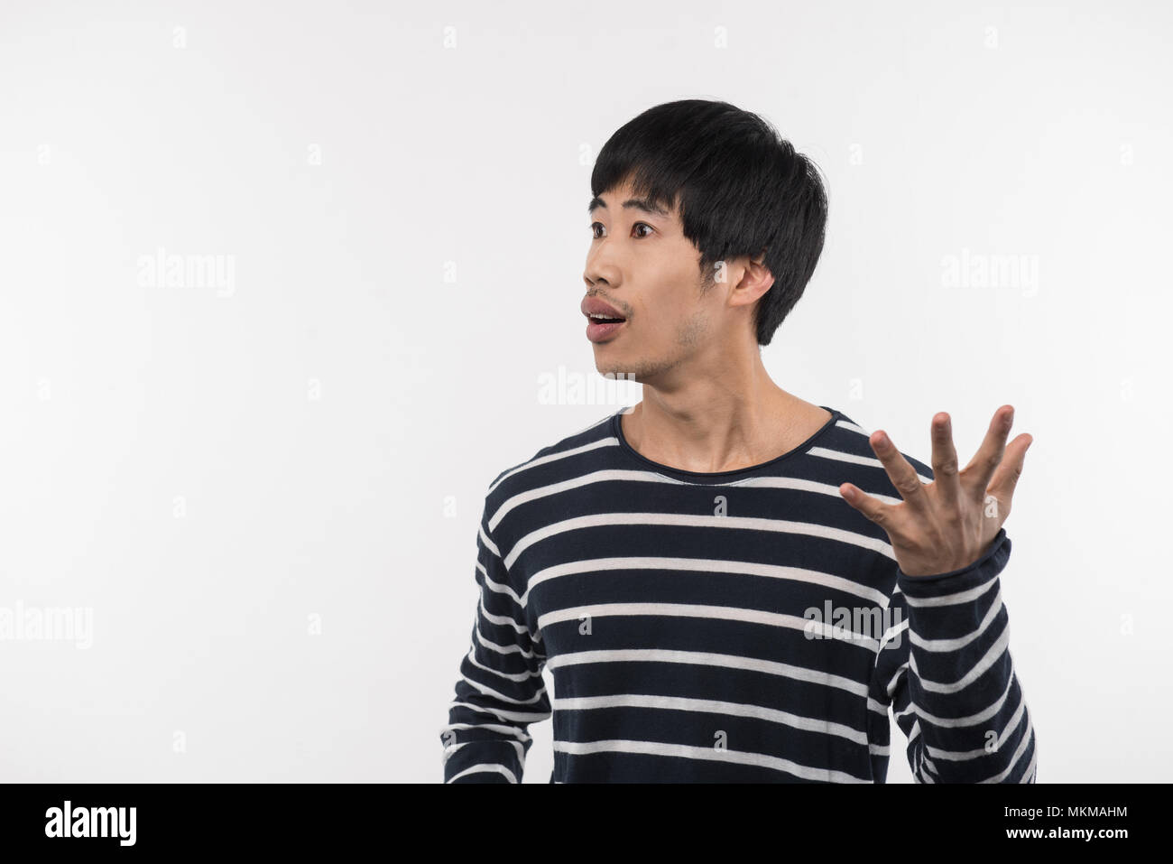 Young emotional man looking aside hi-res stock photography and images ...