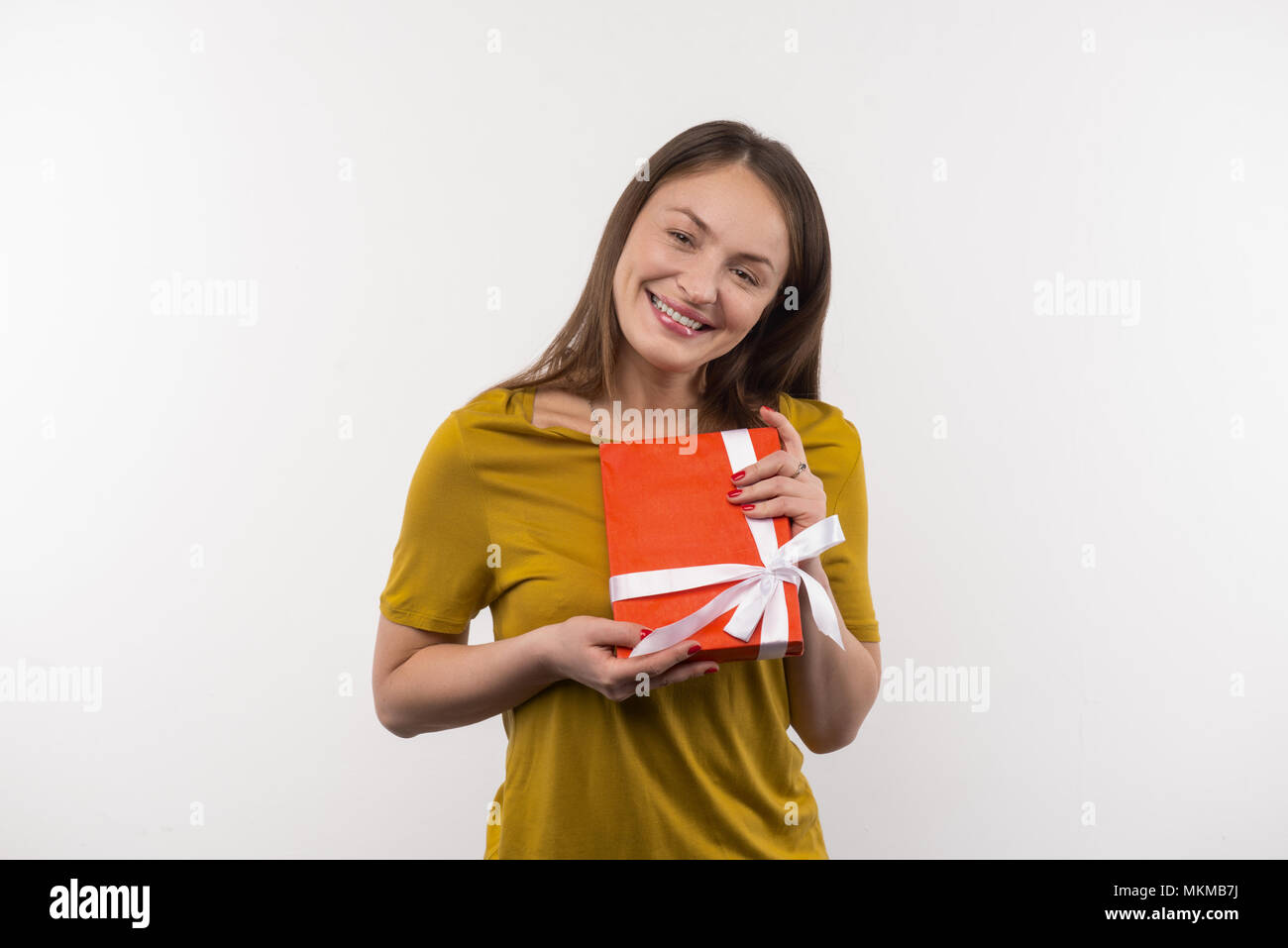 Nice delighted woman receiving a gift Stock Photo - Alamy