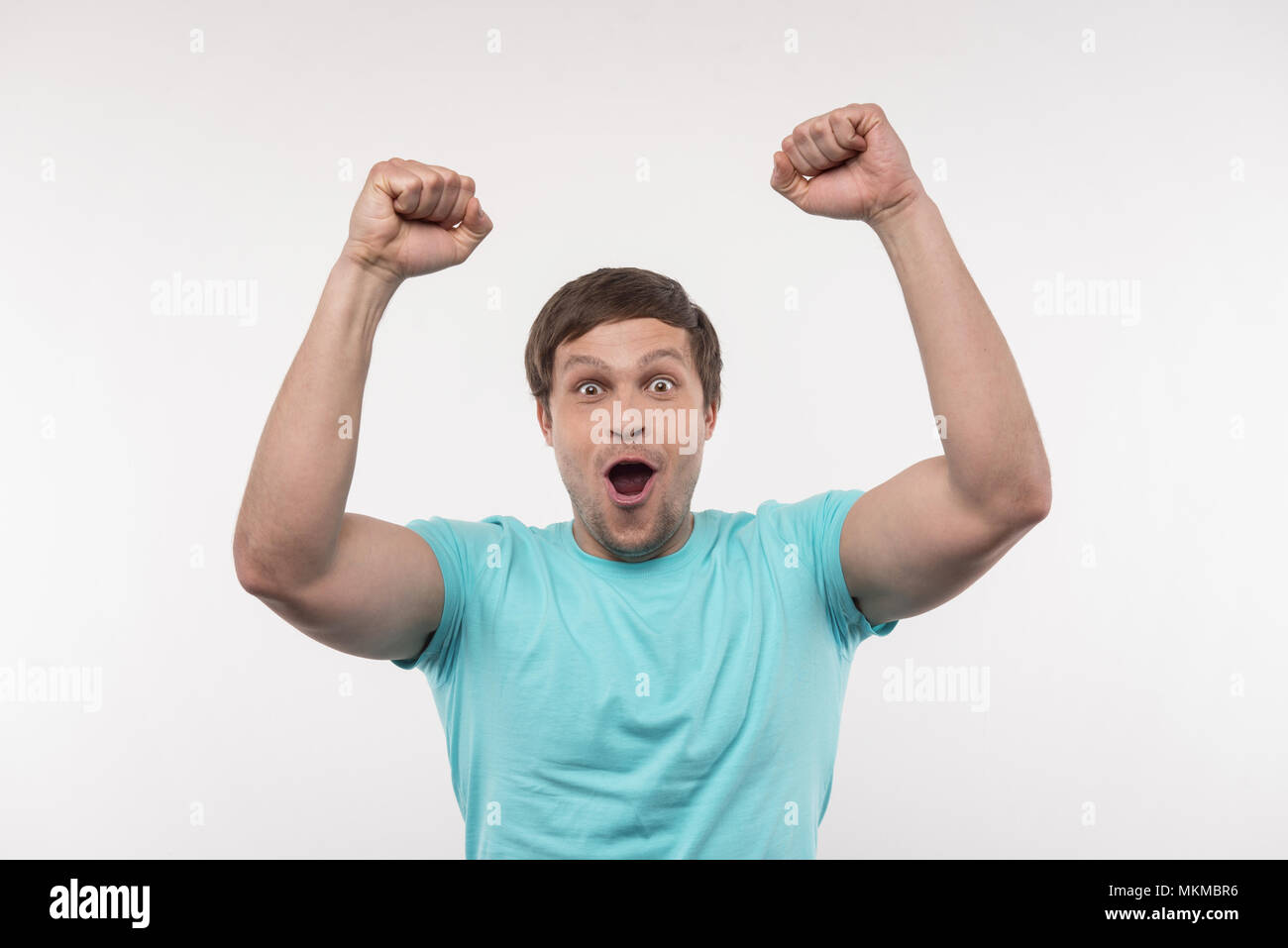 Joyful positive man cheering with his hands Stock Photo - Alamy