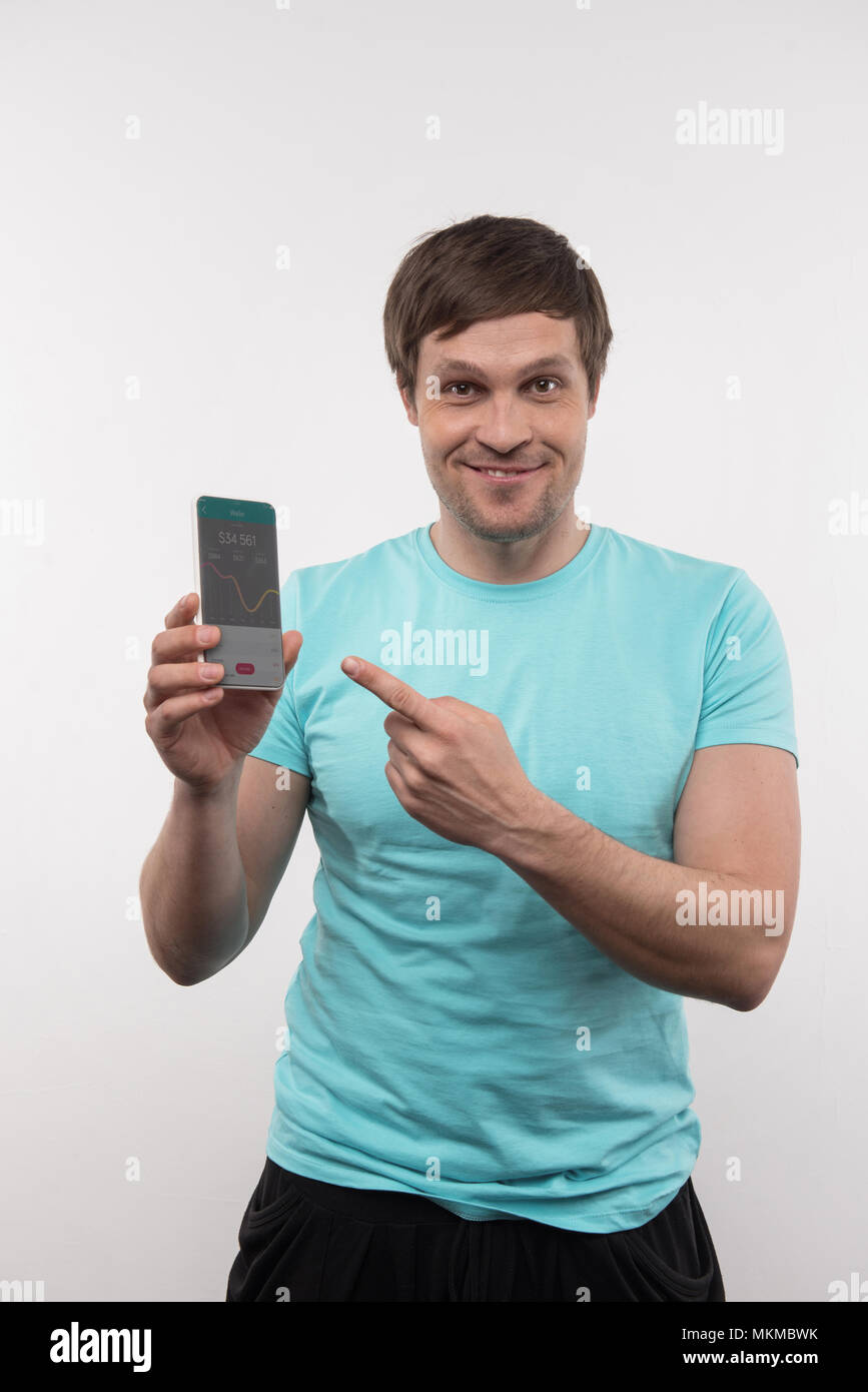 Smart young man investing his money Stock Photo - Alamy