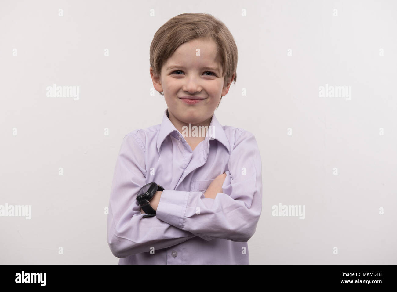Happy cute boy wearing smartwatch Stock Photo - Alamy