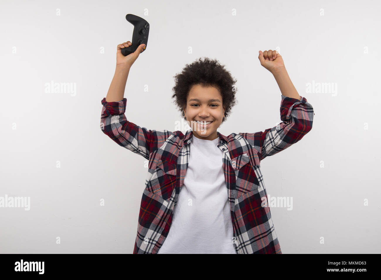 Joyful happy boy cheering Stock Photo - Alamy