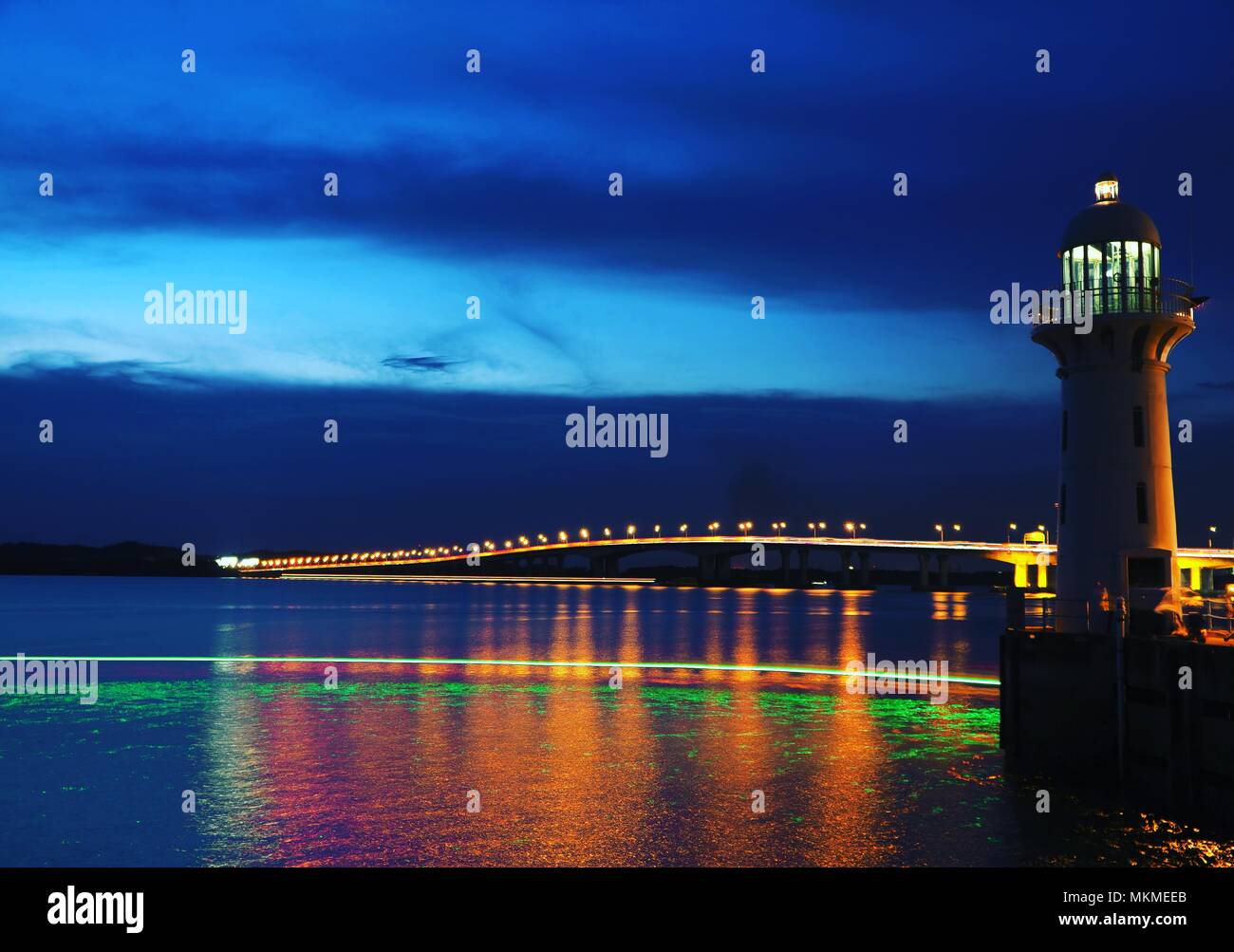 Colorful Night with lighthouse Stock Photo - Alamy