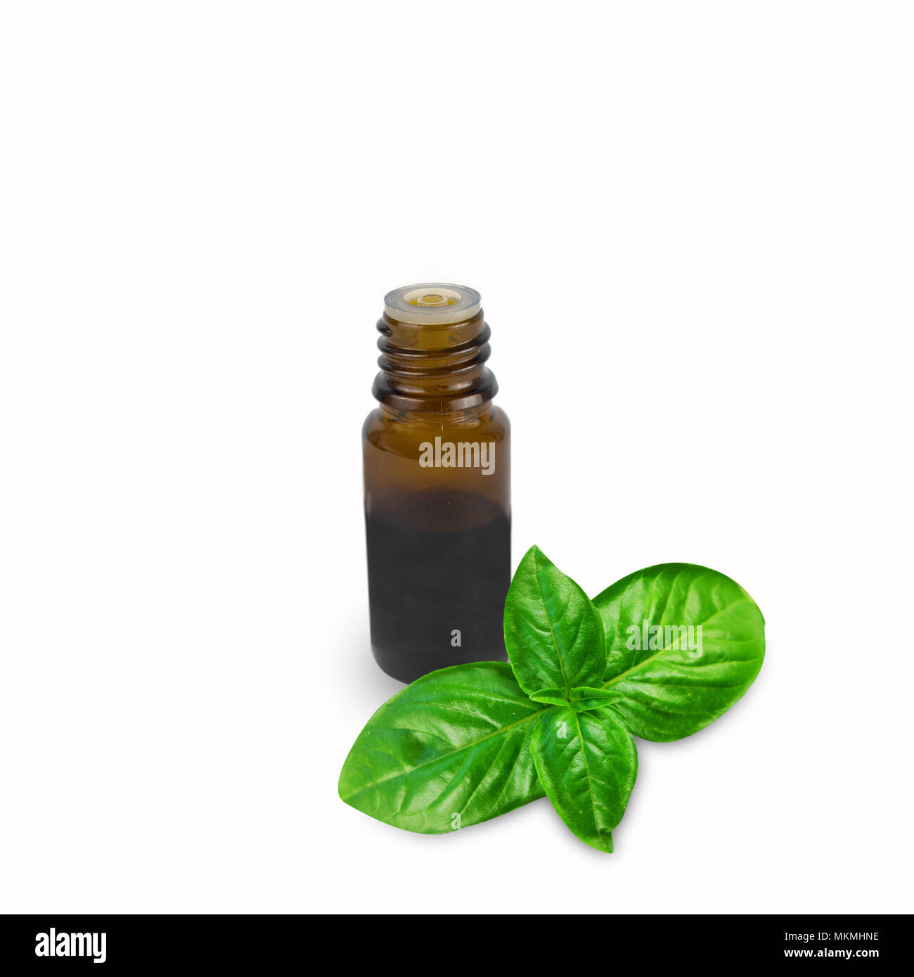 Basil essential oils in bottle isolated on a white background Stock ...