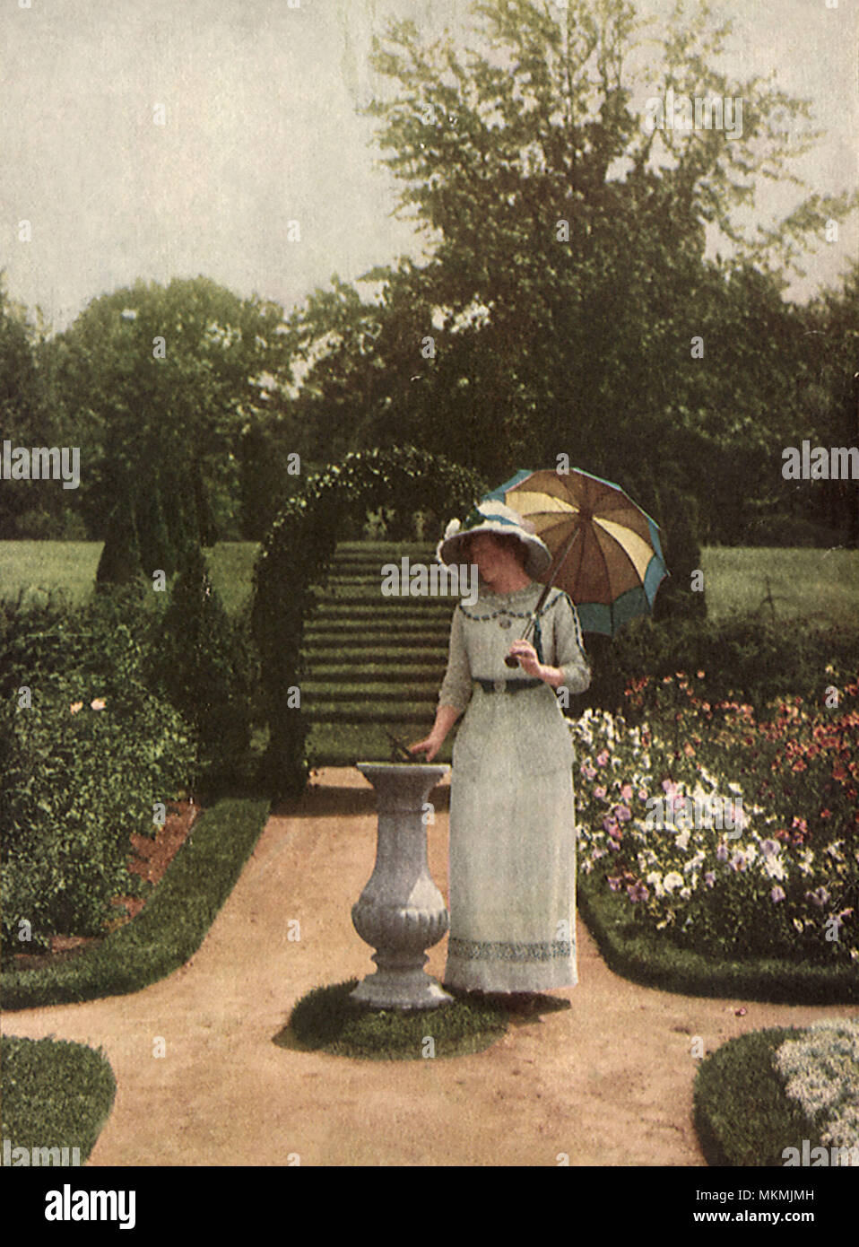 Woman garden sundial hi-res stock photography and images - Alamy