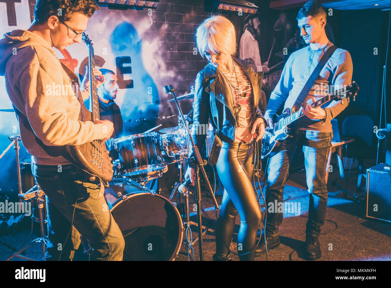 Rock band on stage after successful concert Stock Photo - Alamy