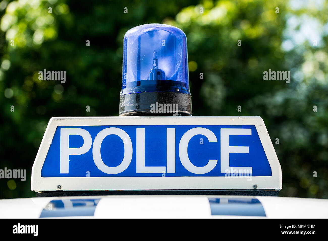 Police sign with blue lights on top of a patrol vehicle Stock Photo - Alamy