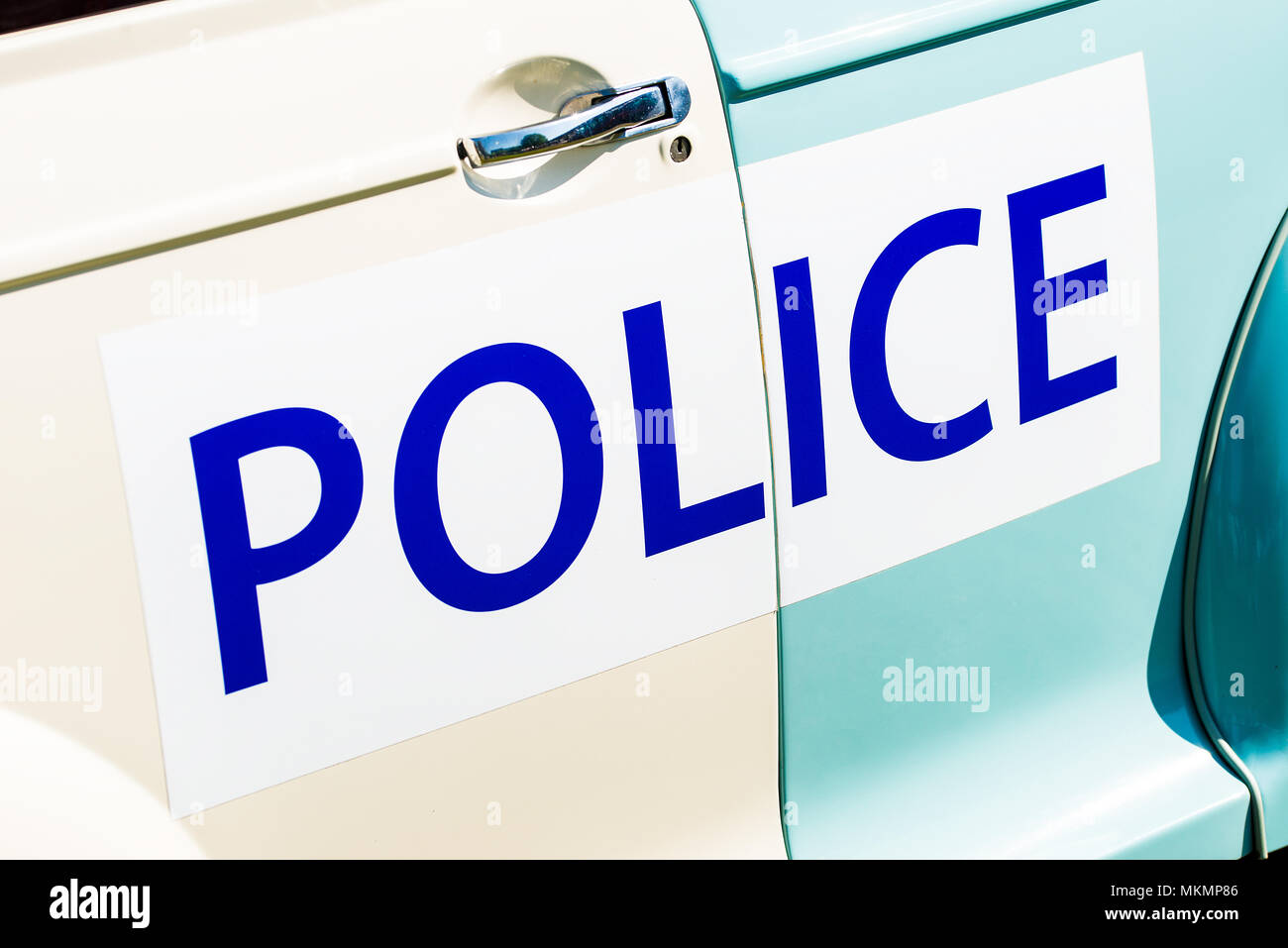 Large police sign on the side of a vintage patrol vehicle Stock Photo ...